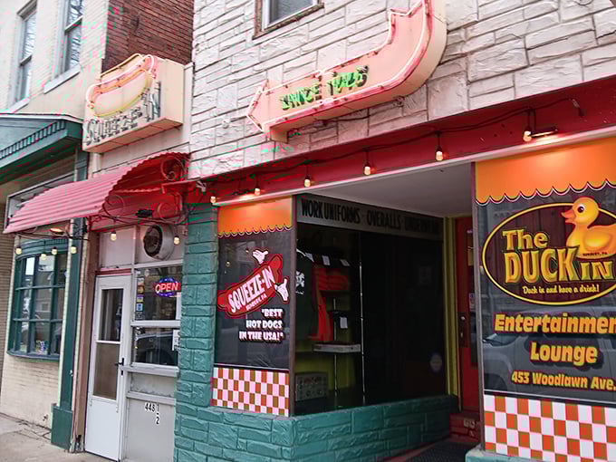 The teal facade and checkered design of The Squeeze-In scream "retro cool." This isn't just a hot dog joint&mdash;it's a time machine!