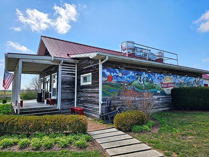 Windy Corner Market: Weathered wood, vibrant mural, and horse country views. The perfect backdrop for some of Kentucky's most satisfying comfort food.