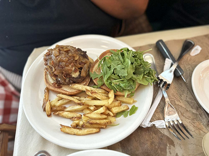 The burger that launched a thousand napkins&mdash;juicy, perfectly stacked, and requiring both hands and possibly a strategy meeting before the first bite.
