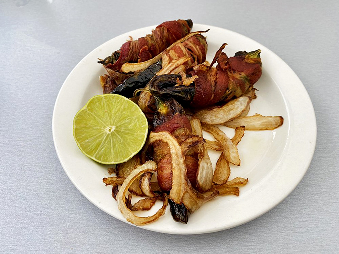 Bacon-wrapped chiles with caramelized onions&mdash;proof that sometimes the best relationships are the unexpected ones. The lime adds the perfect zing.