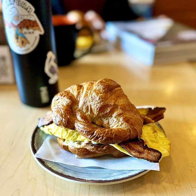 Two perfectly toasted slices holding the holy trinity of breakfast: eggs, bacon, and cheese. This sandwich doesn't need a fancy name to be memorable.