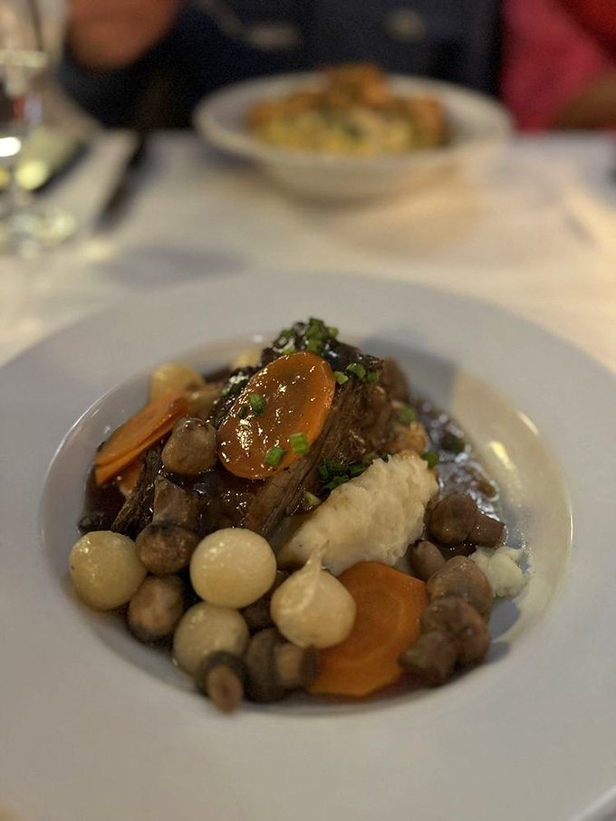 Beef bourguignon: where humble ingredients transform into nobility. Those pearl onions and mushrooms have been promoted to royalty in that wine sauce.