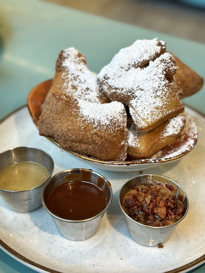 These beignets aren't just fried dough&mdash;they're pillowy clouds of happiness served with dipping sauces that'll make you forget New Orleans.