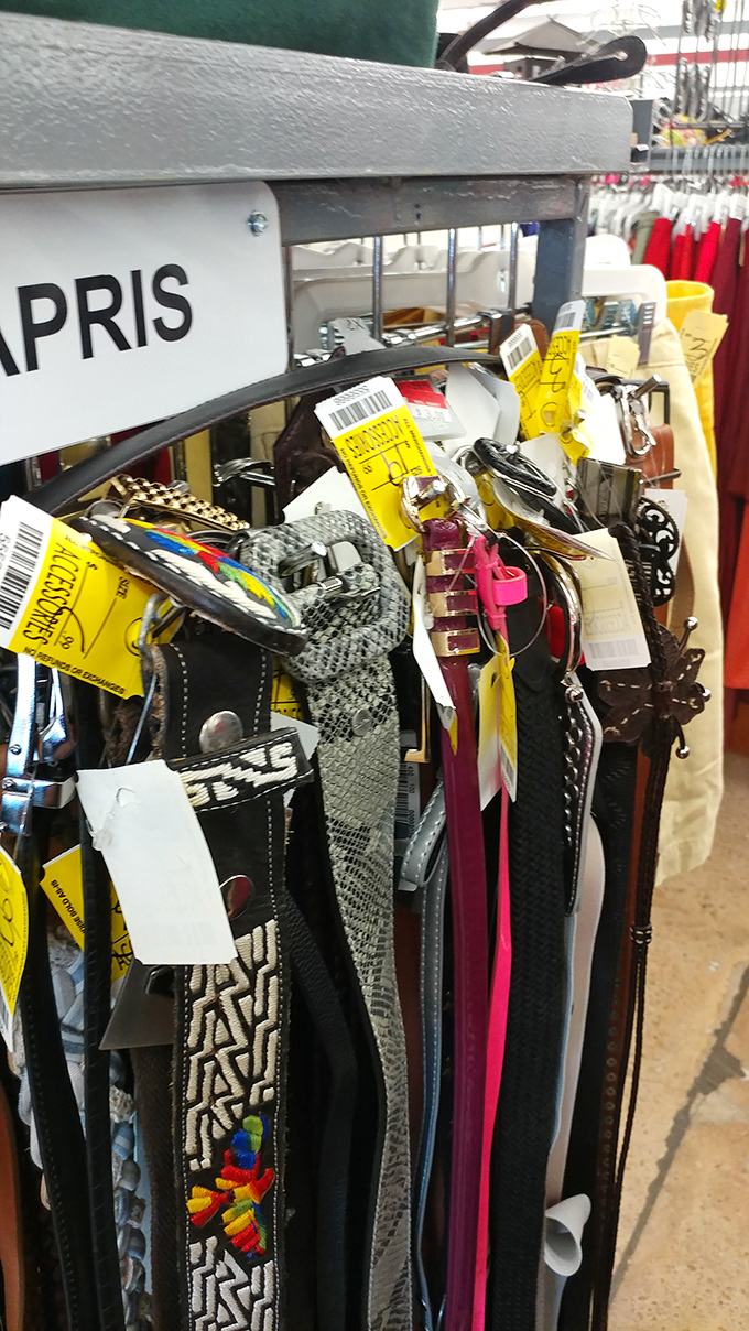 The belt section: a leather rainbow where fashion statements from multiple decades hang together in harmonious discord.