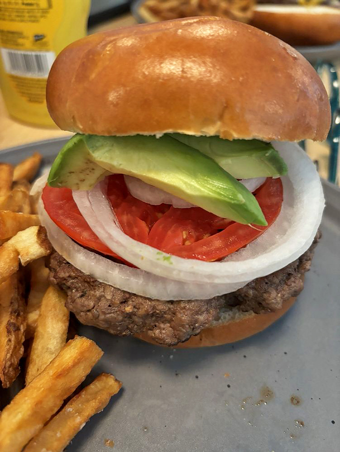 A burger so photogenic it could have its own Instagram. The fries and pink lemonade complete this holy trinity of lunch perfection.