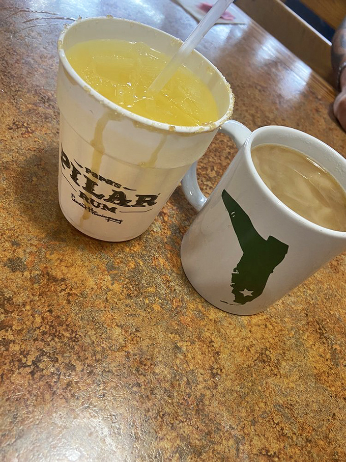 Florida-shaped mugs holding liquid sunshine and caffeine courage. The state outline reminds you exactly where this flavor revolution is happening.