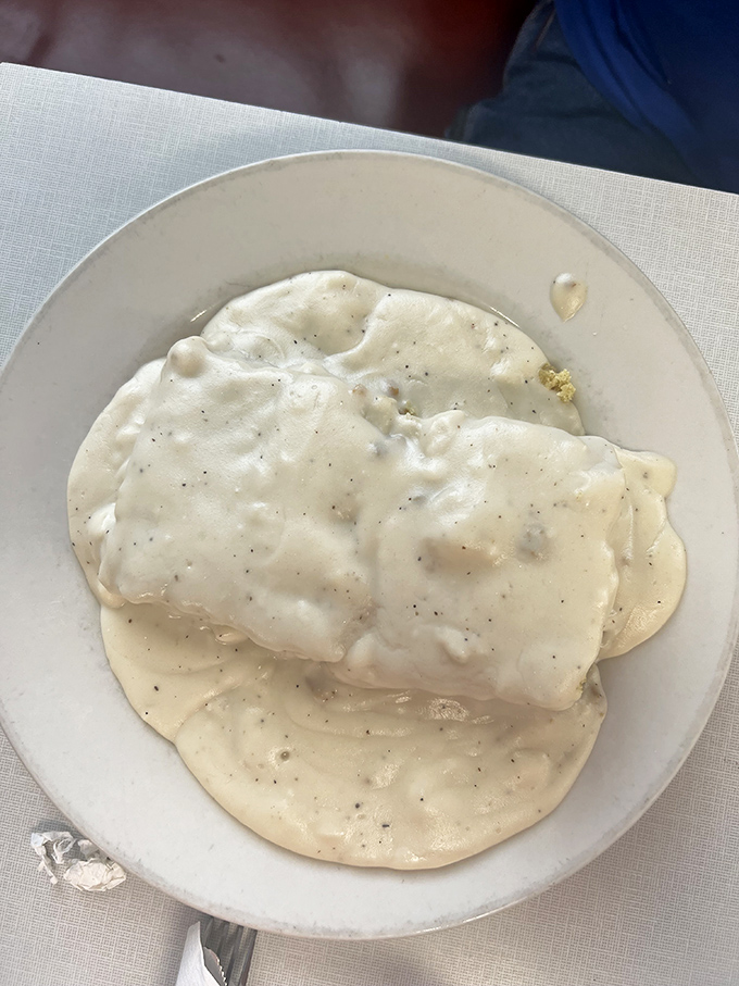 Clouds of peppery gravy blanket tender biscuits in this plate of Southern comfort that has clearly earned its Midwestern citizenship papers.