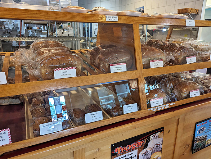 The bread display&mdash;where carb-counting goes to surrender. Each loaf sits proudly like it knows it's about to be the best part of someone's day.