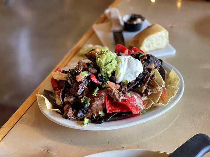 These brisket nachos aren't just a dish&mdash;they're an architectural achievement. The holy trinity of meat, cheese, and avocado in perfect harmony.