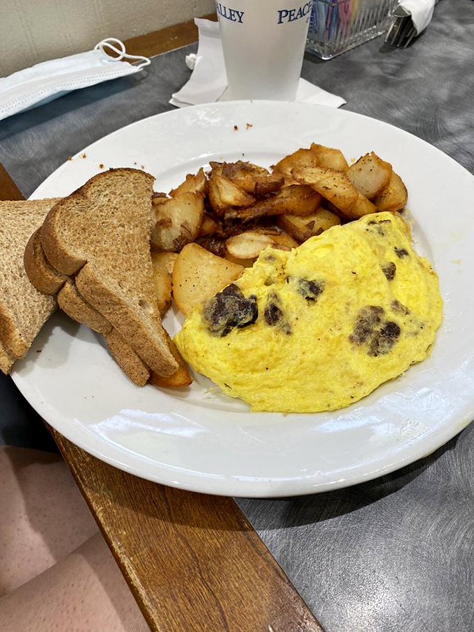 A fluffy omelet that practically floats alongside perfectly crisped potatoes &ndash; the breakfast equivalent of hitting the lottery.