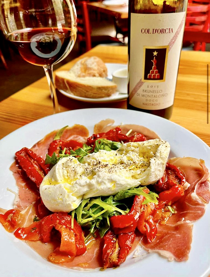 Fresh burrata with roasted peppers and prosciutto&mdash;proof that the simplest ingredients, when perfect, create the most profound pleasures. 