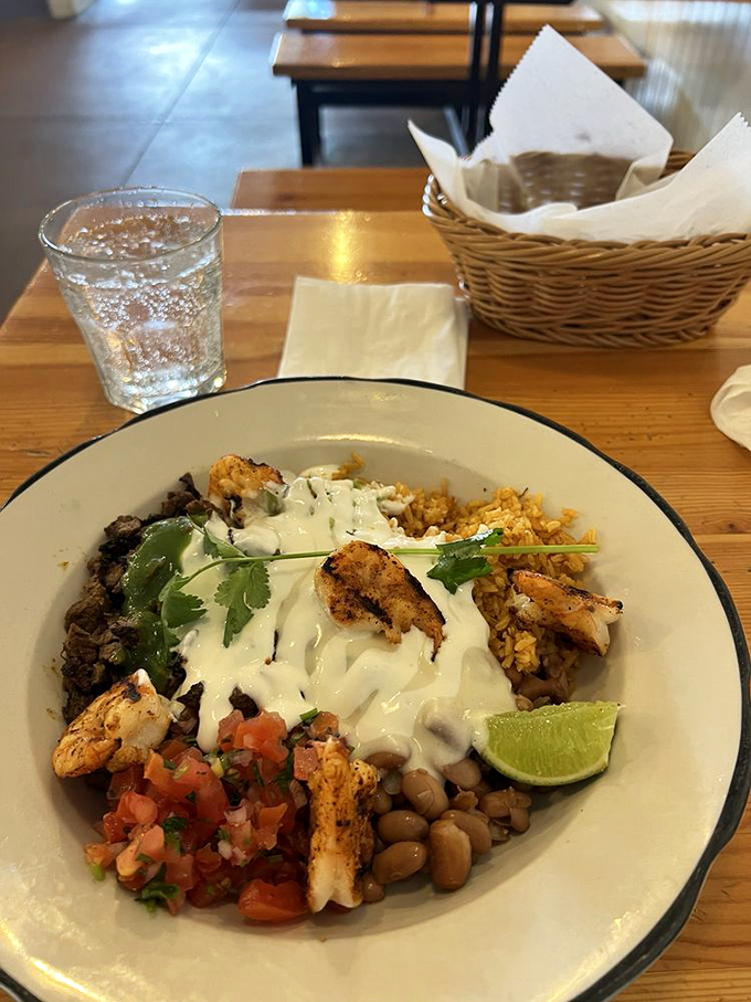 A bowl that brings together shrimp, beans, rice, and crema like the Avengers of flavor&mdash;each element heroic on its own, unstoppable together.