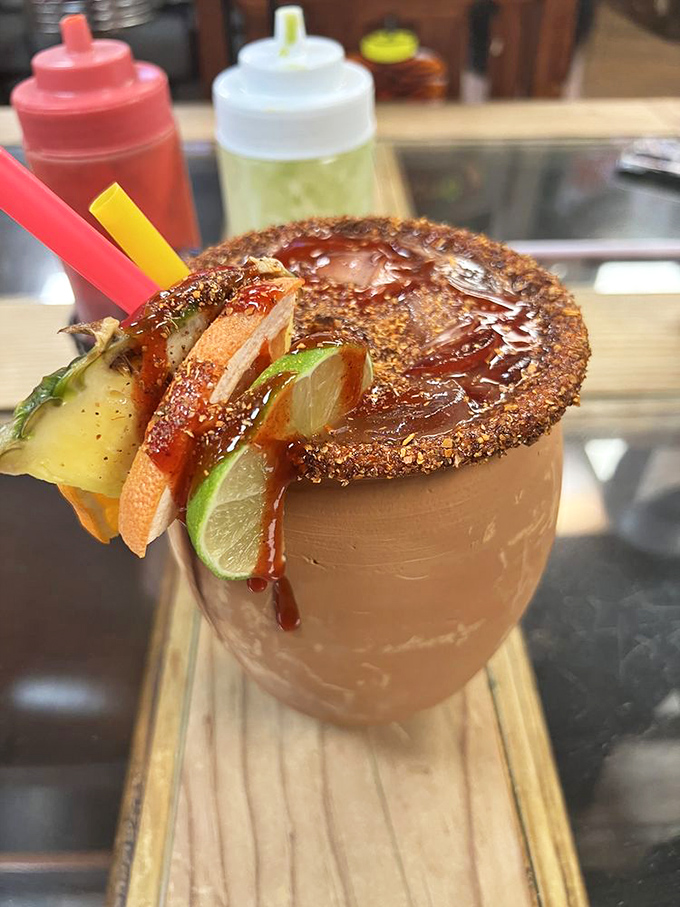 This isn't just a drink; it's liquid vacation. The Cantarito's rim of Taj&iacute;n and fresh fruit garnishes transforms ordinary moments into celebrations.
