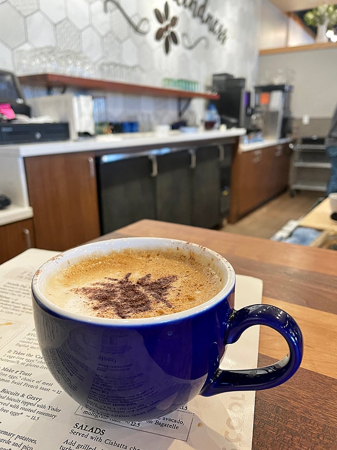 This isn't just coffee&mdash;it's liquid motivation in a signature blue mug. The foam art is just showing off at this point.