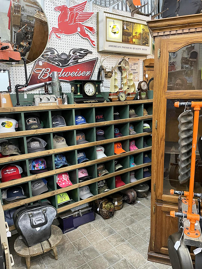 Baseball caps as historical artifacts&mdash;each representing someone's team loyalty, vacation destination, or workplace pride. A wall of American identity in fabric form.