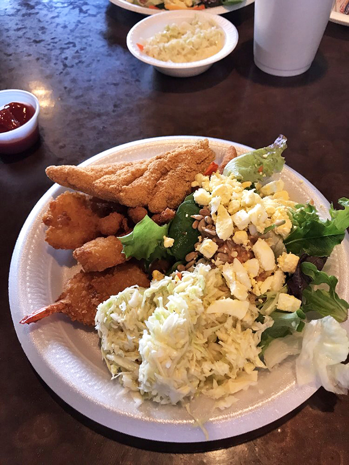 The perfect plate balance: golden catfish, succulent shrimp, and just enough greens to convince yourself this is a balanced meal.
