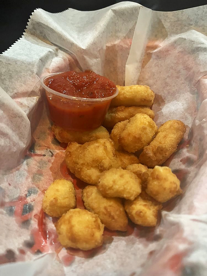 Golden-fried cheese nuggets nestled in paper&mdash;little bundles of joy that make you wonder why salads even exist in the first place.