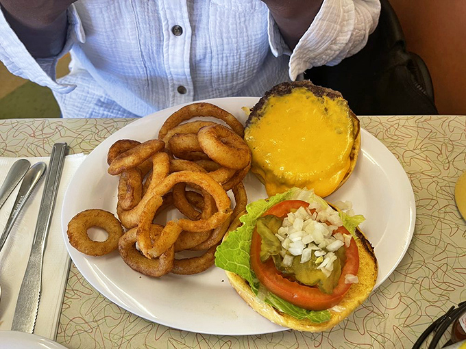 This burger doesn't need a fancy pedigree or artisanal backstory. It simply delivers the primal satisfaction of beef, cheese, and those gloriously golden rings.