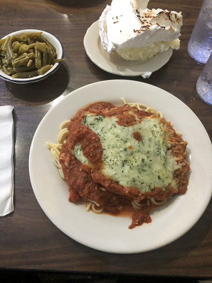 The chicken parmesan doesn't just sit on those noodles&mdash;it reigns supreme, while that slice of cream pie waits patiently for its moment of glory.