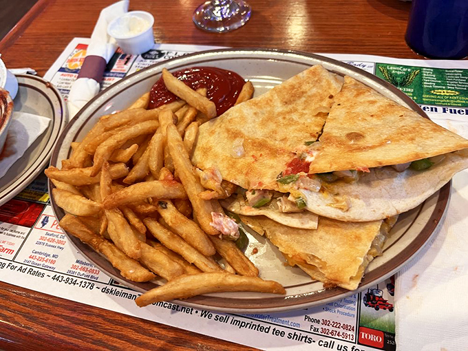 A quesadilla that doesn't skimp on the good stuff&mdash;crispy exterior, melty interior, and fries that could start their own fan club.