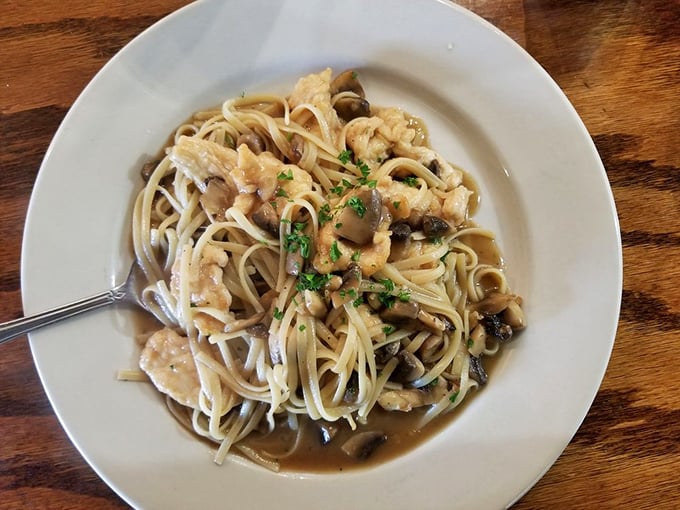 Chicken marsala with a side of seafood&mdash;the surf and turf combo that makes you wonder why you'd ever order them separately.