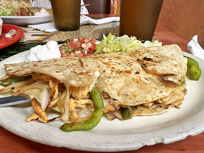 This quesadilla isn't just folded&mdash;it's transformed. Crispy exterior, molten interior, and toppings that make every bite a celebration.