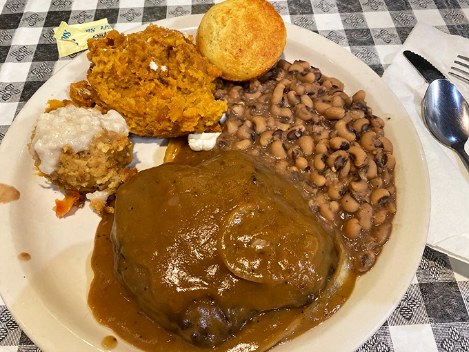 Gravy isn't just a topping here&mdash;it's practically a philosophy. This chopped steak swimming in savory goodness proves the point deliciously.