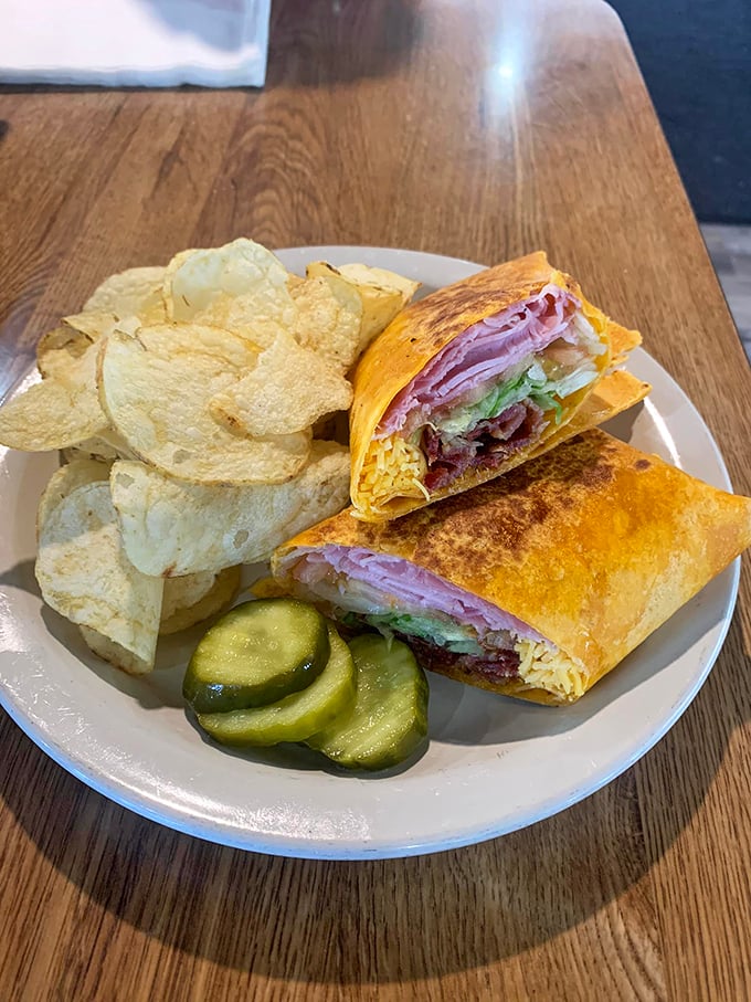 This wrap isn't just a sandwich&mdash;it's architecture. Layers of ham, cheese, and veggies with potato chips standing guard like crunchy sentinels.
