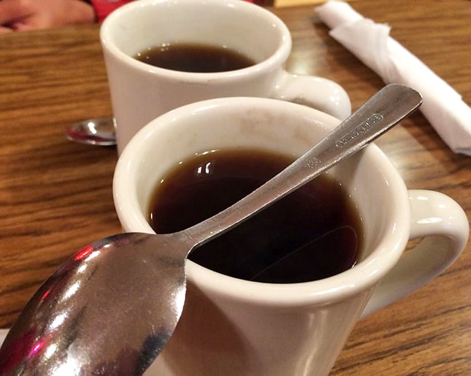 Two sturdy white mugs of coffee&mdash;the kind that doesn't need fancy names or foam art to get the job done right. 