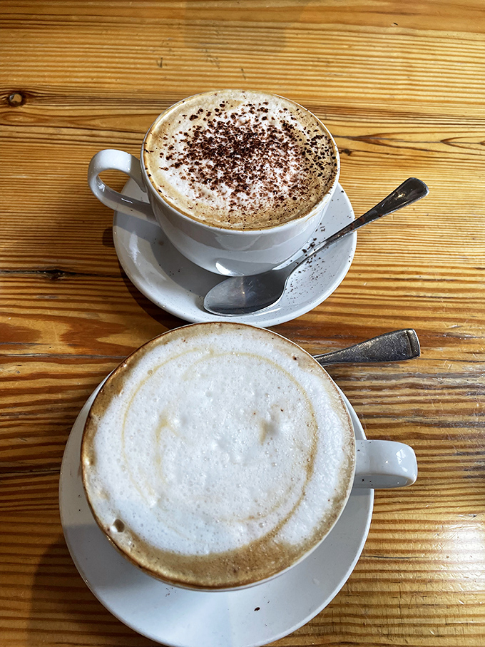 Coffee art so pretty you almost don't want to drink it. Almost. The wooden table adds that "I'm having a moment" ambiance.