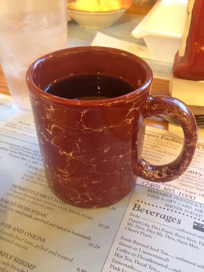That marble-patterned coffee mug has seen things. Countless refills, endless conversations, and the perfect companion to homestyle cooking since before Instagram existed.