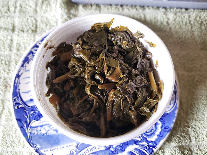 Collard greens&mdash;the unsung hero of barbecue sides. These aren't just vegetables; they're pork-infused Southern comfort in a bowl.