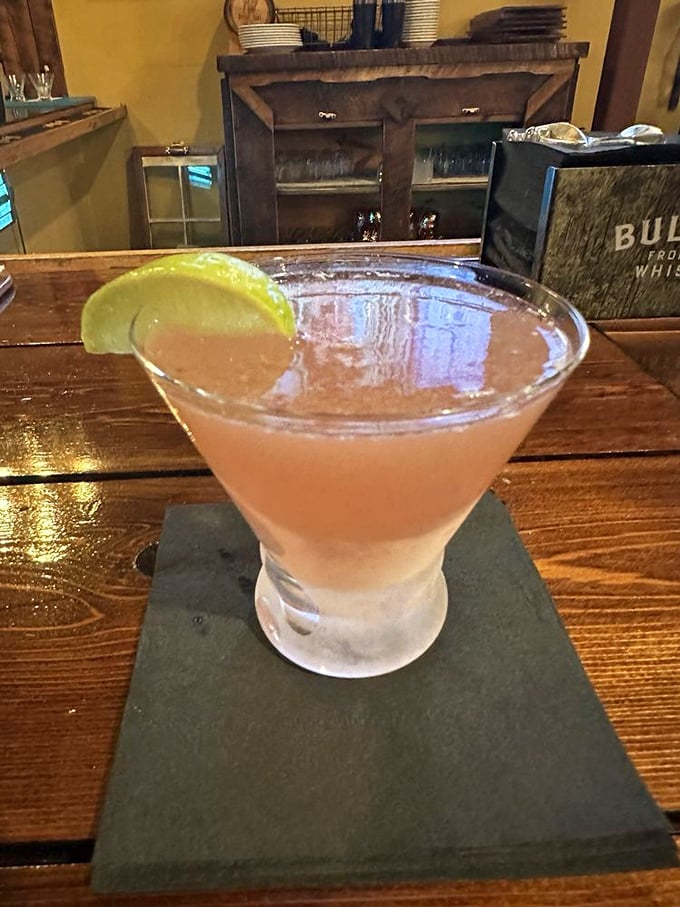 A perfectly chilled cocktail waiting at the bar&mdash;because sometimes you need something pink and potent before tackling a 22-ounce ribeye.