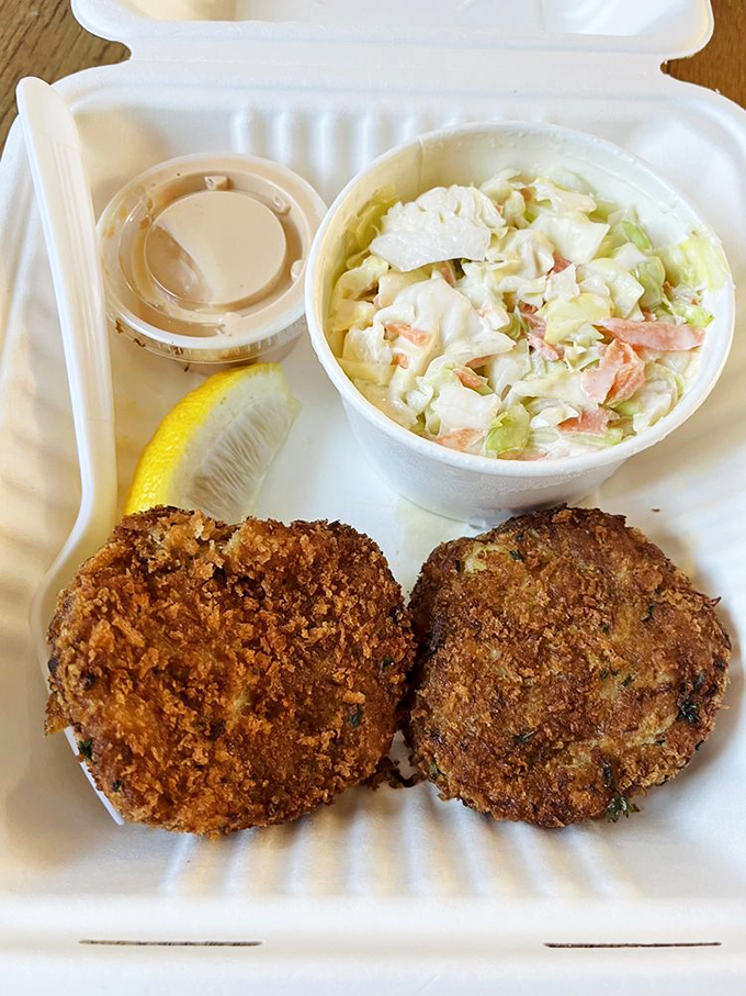 These golden-brown crab cakes aren't just fried&mdash;they're elevated. Paired with that creamy coleslaw, they're the dynamic duo of seafood satisfaction.