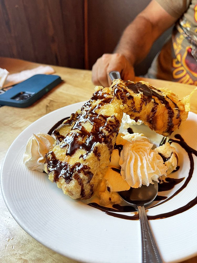 Dessert nirvana achieved! This deep-fried cheesecake with chocolate drizzle answers the question, "How can we make cheesecake even more indulgent?"