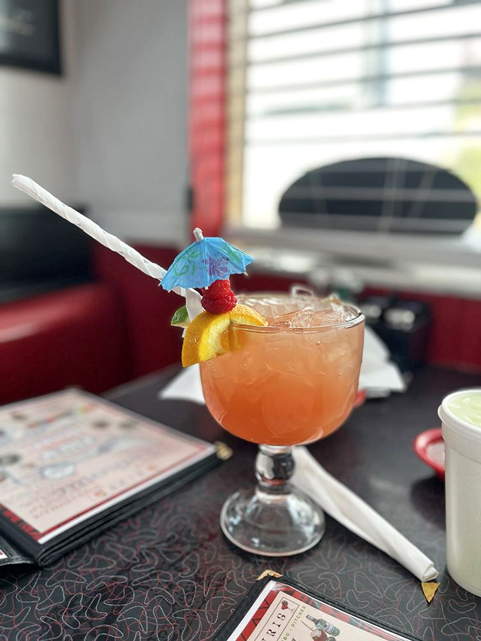 This isn't just a cocktail; it's a vacation in a glass, complete with tiny umbrella real estate and fruit that counts as a vitamin.