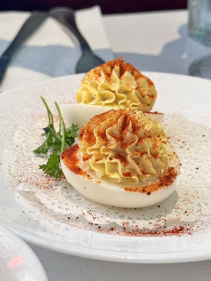 Deviled eggs so meticulously piped they could win a beauty pageant. That sprinkle of paprika is the tiara on top.