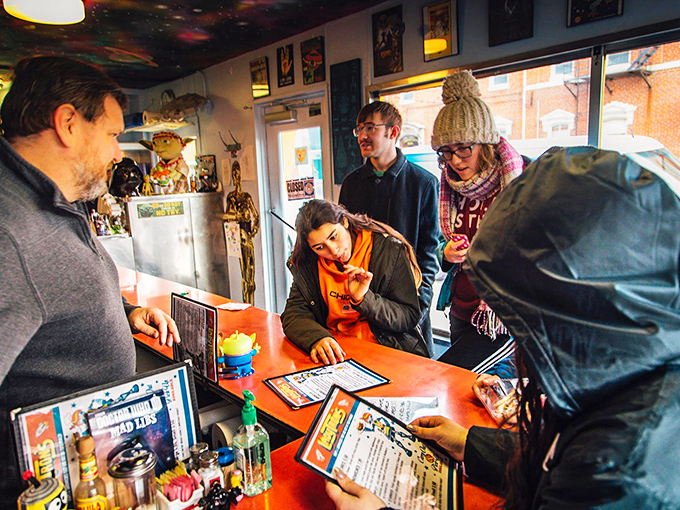The joy of discovery happens daily at Lady Tron's counter, where patrons ponder menu options surrounded by memorabilia from galaxies far, far away.