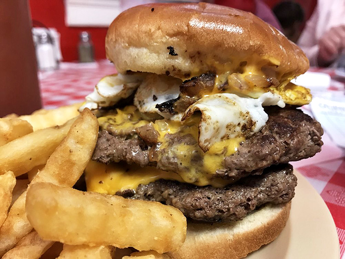 Breakfast meets burger in this magnificent creation. The runny egg and crispy bacon transform an already legendary double cheeseburger into something transcendent.