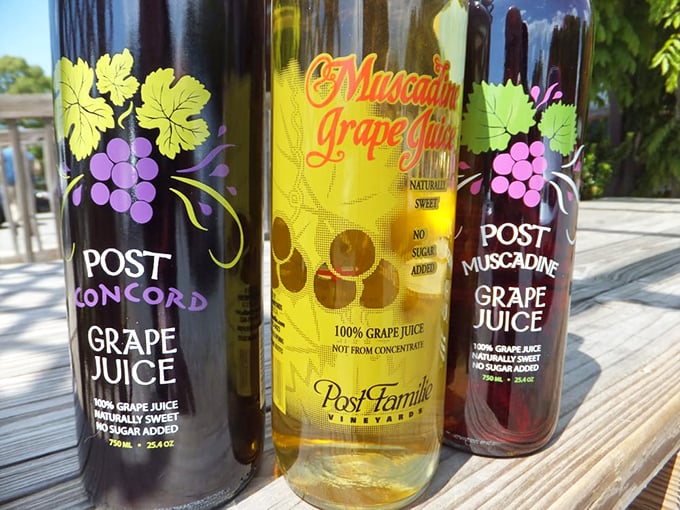Local grape juices line up like wine bottles at a tasting. The Muscadine varieties offer a sip of pure Southern sunshine without artificial anything.