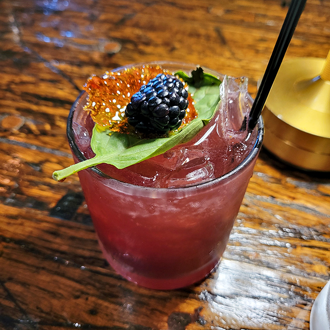 This cocktail, garnished with a blackberry and sage leaf, isn't just a drink&mdash;it's liquid artwork that happens to make your troubles disappear.