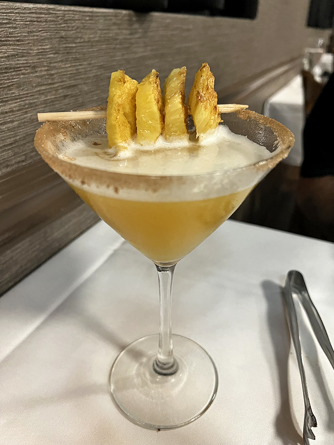 A tropical cocktail garnished with grilled pineapple&mdash;because when you're eating like Brazilian royalty, your drink should dress accordingly. 