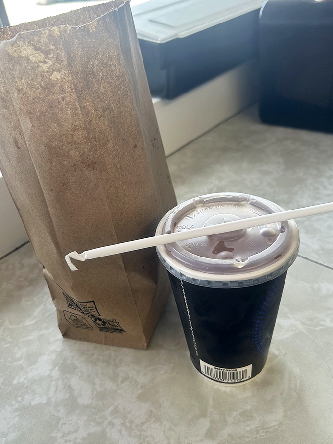 The universal language of takeout &ndash; a humble paper bag and sturdy drink, ready to transform your car into the best restaurant in town.