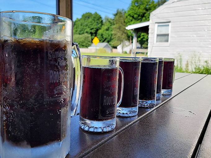 Frosty mugs of homemade root beer lined up like soldiers, each one a dark, sweet promise of refreshment.
