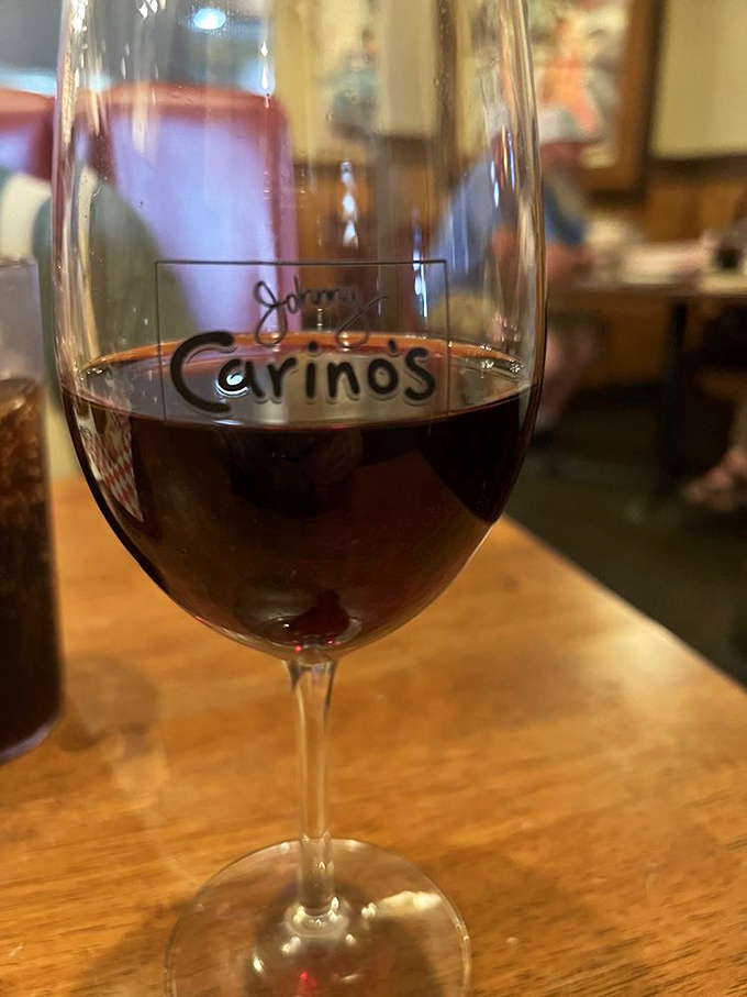 The wine glass sporting the Carino's logo reminds you that sometimes the best souvenirs aren't the ones you pack &ndash; they're the memories you drink in.