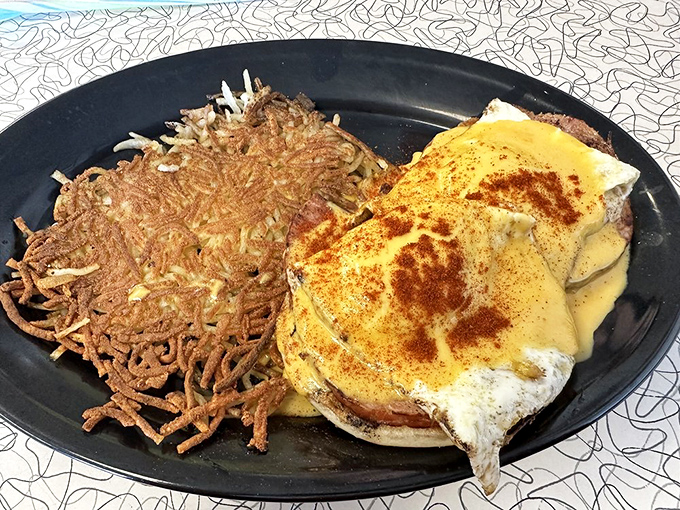Eggs Benedict done diner-style: unfussy, generous, and with hash browns so perfectly crisp they deserve their own appreciation society.