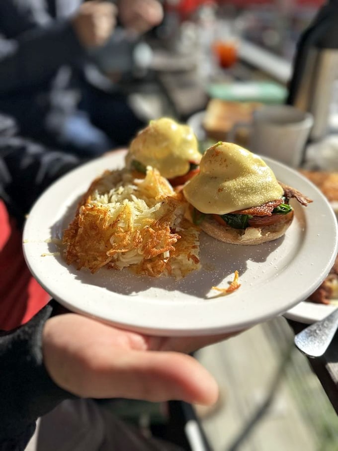 Eggs Benedict: where hollandaise meets hash browns in perfect harmony. This plate is the breakfast equivalent of hitting all green lights on your morning commute.