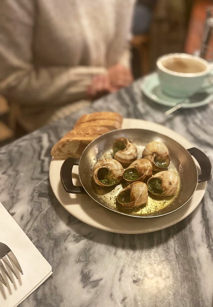 Escargot: where butter, garlic, and courage meet. Trust me, these little guys are the gateway drug to French cuisine addiction.
