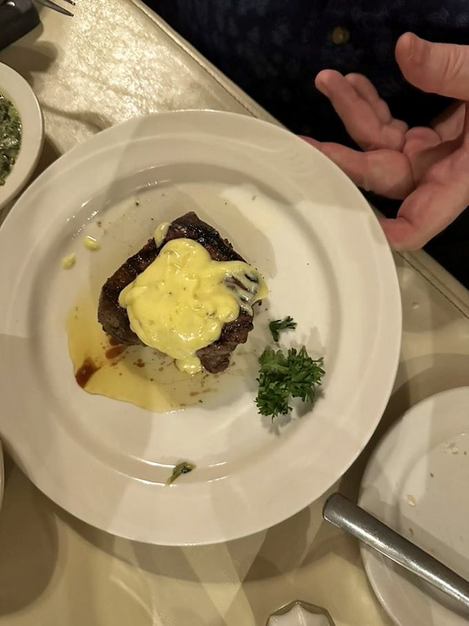 Bearnaise sauce cascading over beef like a warm French blanket. This rich, buttery addition transforms an already perfect steak into something borderline illegal.