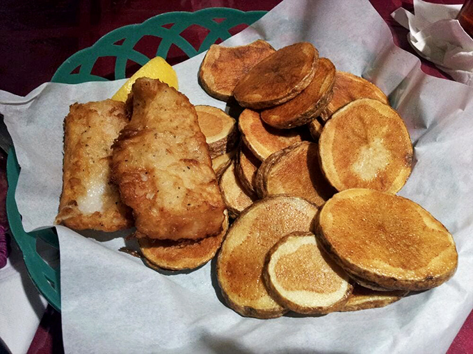 Fish and chips that would make a Londoner homesick. Golden, crispy perfection that shatters with each bite, revealing flaky white fish beneath.